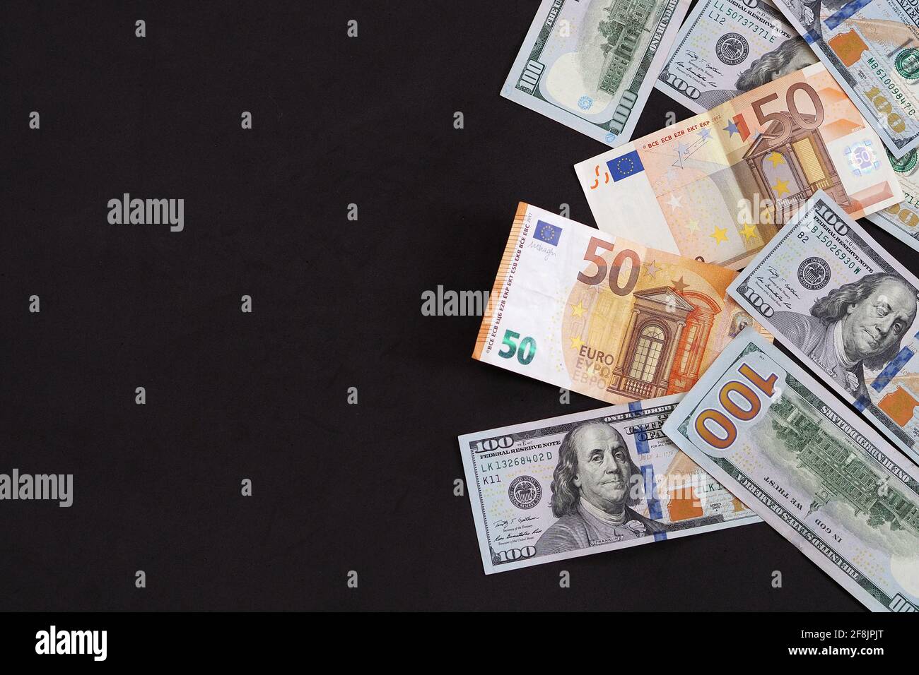 dollar and euro stand side by side, 50 euro and 100 dollar Stock Photo ...
