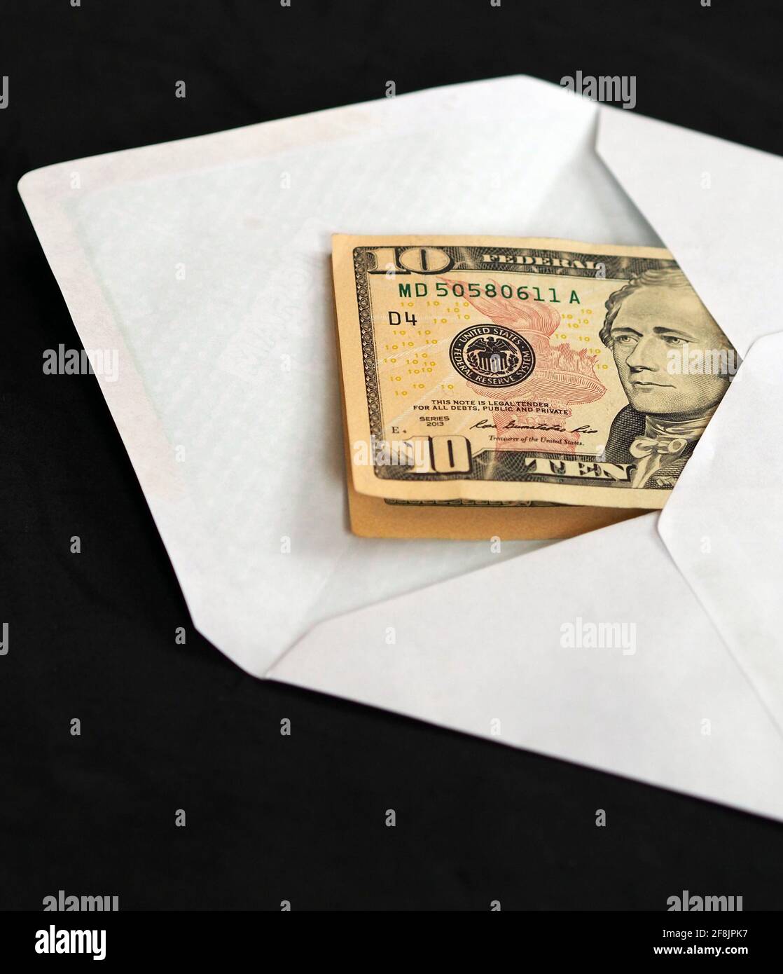 10 dollars in a white envelope, $ 10 in white envelope Stock Photo - Alamy