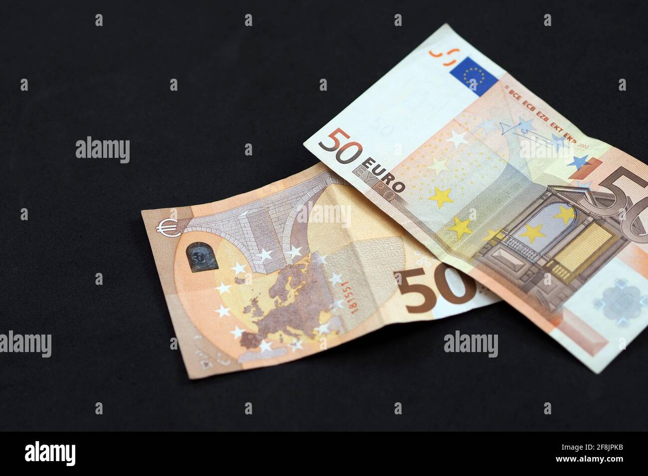 new and old 50 euro banknotes stand on black background Stock Photo - Alamy