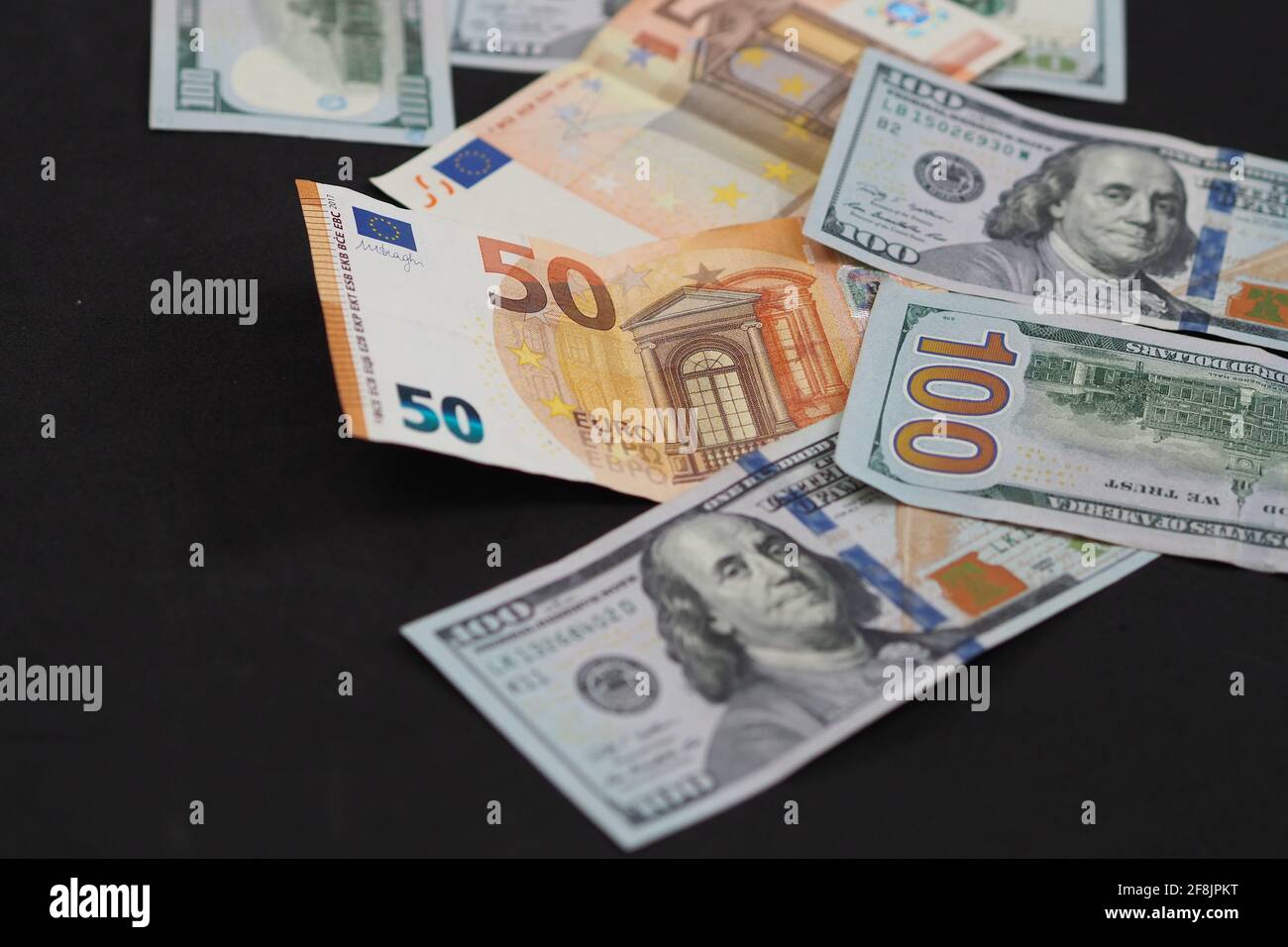 dollar and euro stand side by side, 50 euro and 100 dollar Stock Photo ...