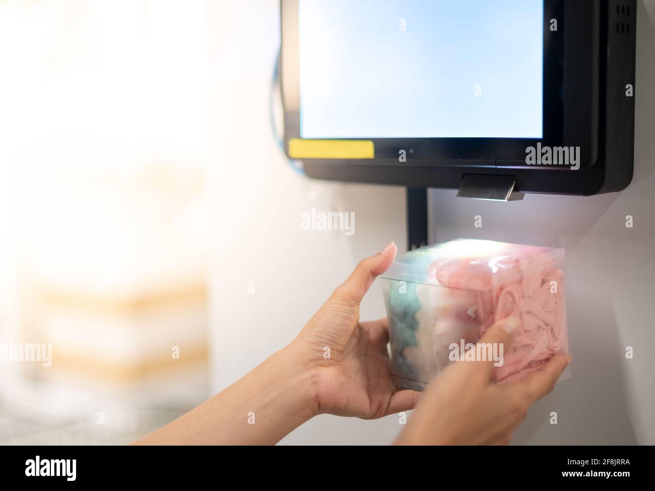 Female hand holding goods scanning barcode on information machine for ...