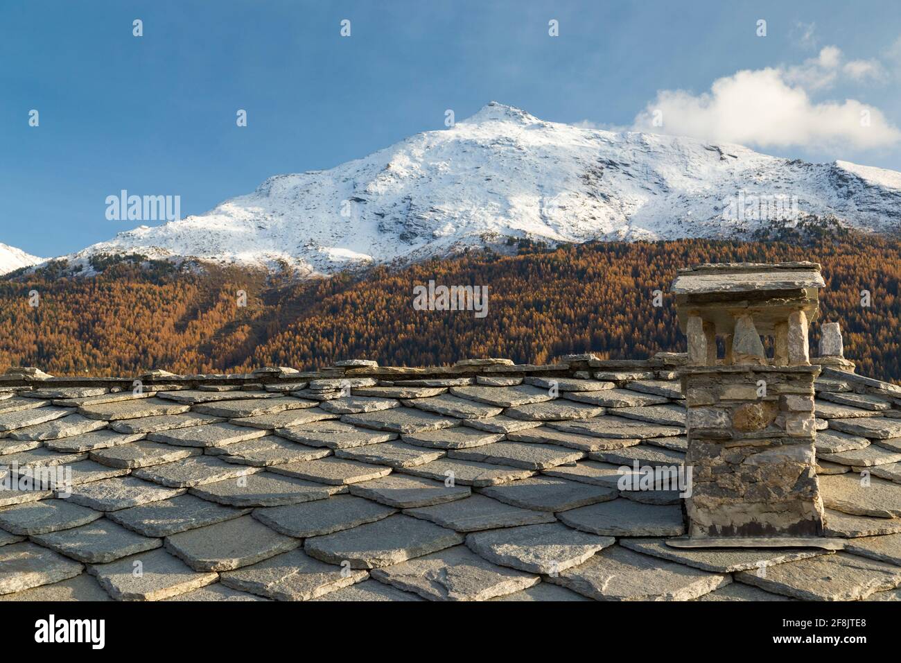 Slate roof and chimney in the Alps Stock Photo - Alamy