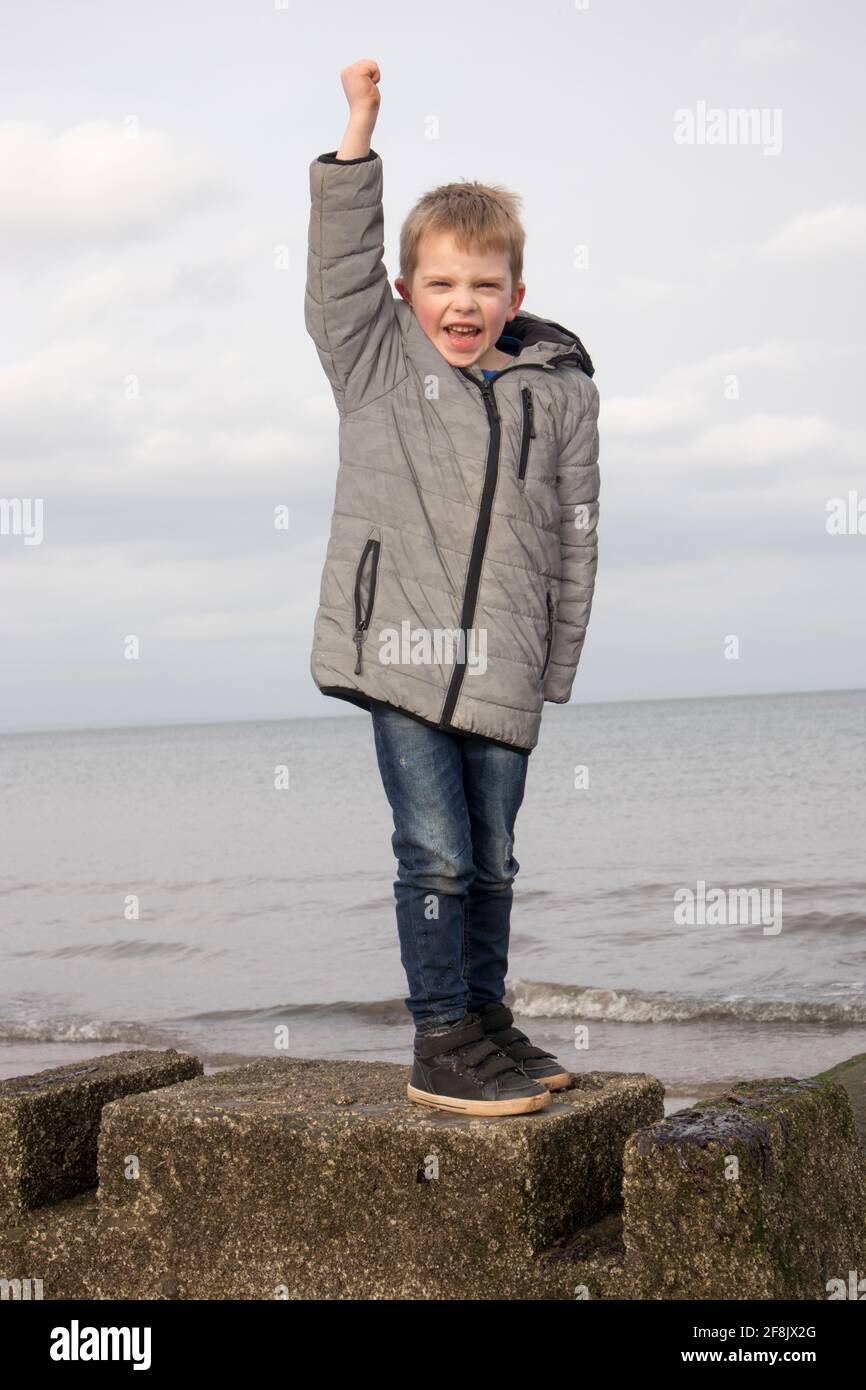 Young boy celebrates Stock Photo - Alamy