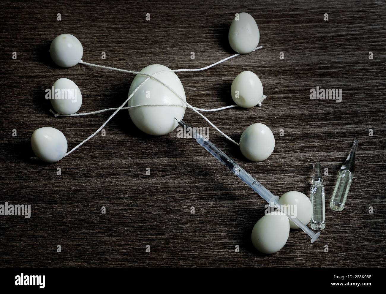 still life with boiled chicken eggs and a syringe for injections Stock ...