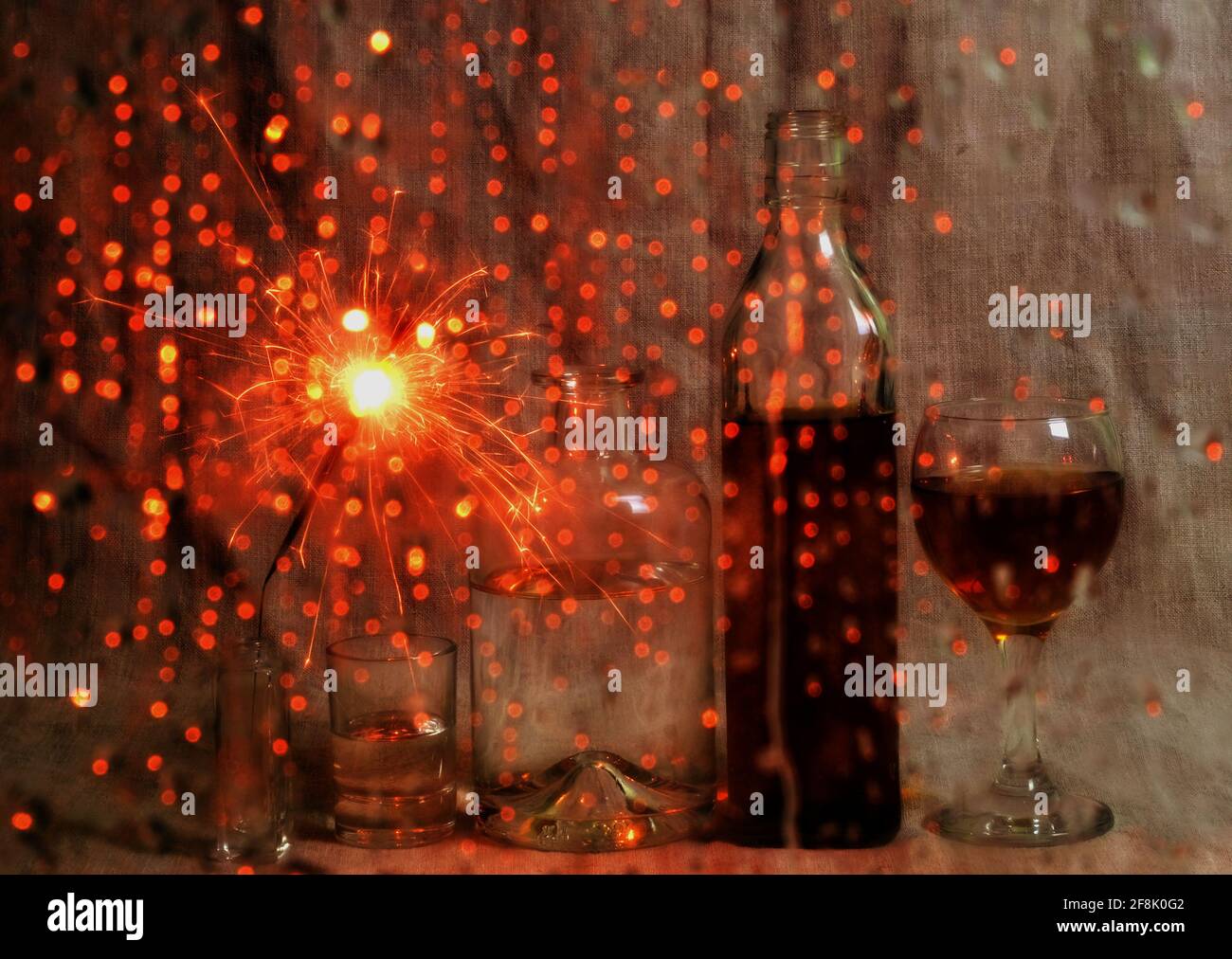 still life with a bottle of wine and Bengali fire Stock Photo - Alamy
