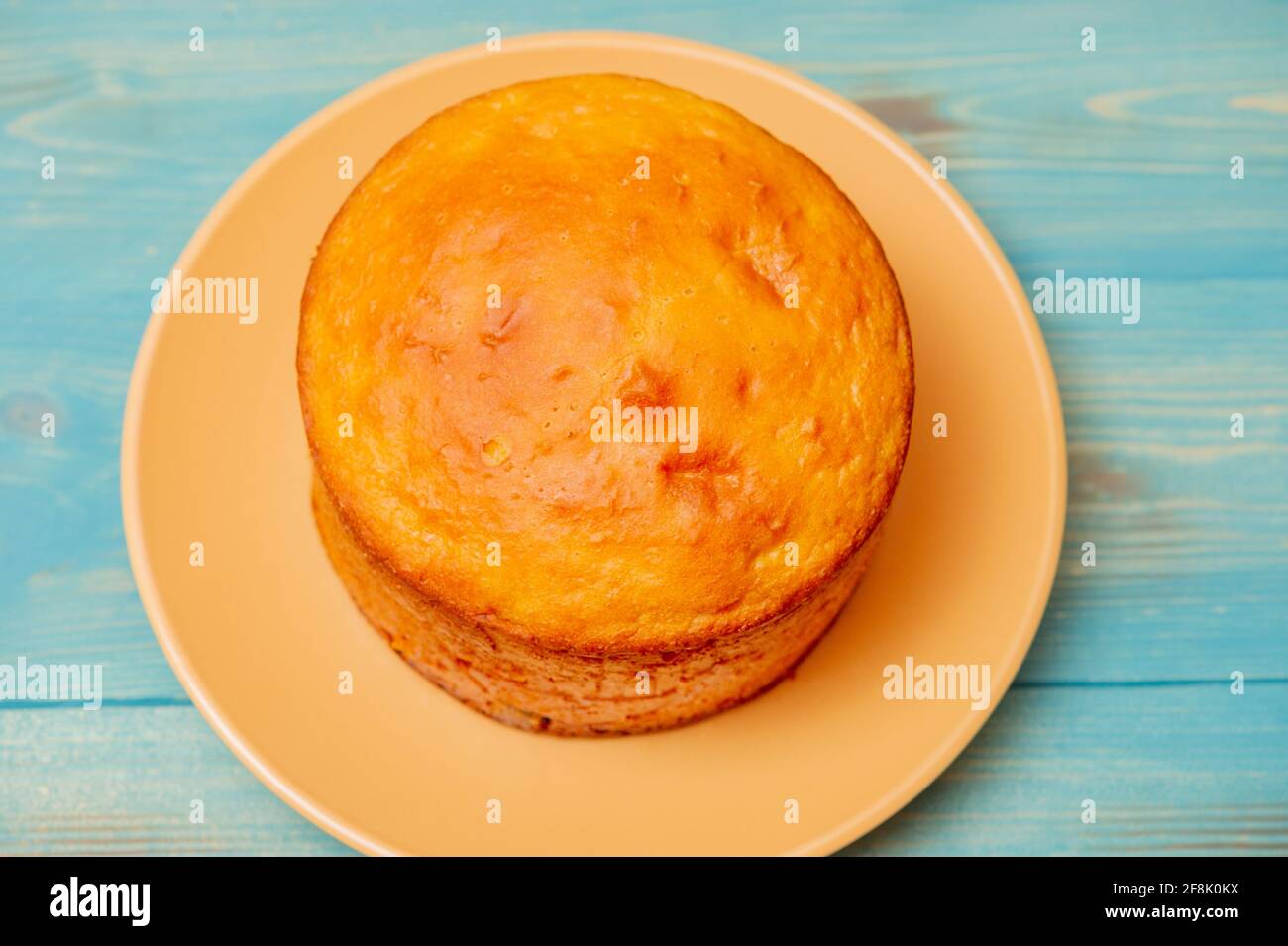 Sweet pastries on beige plate on turquoise wood background Stock Photo ...