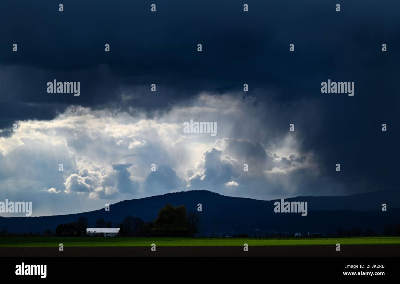 Karben, Germany. 14th Apr, 2021. A cloud front passes over the Taunus ...