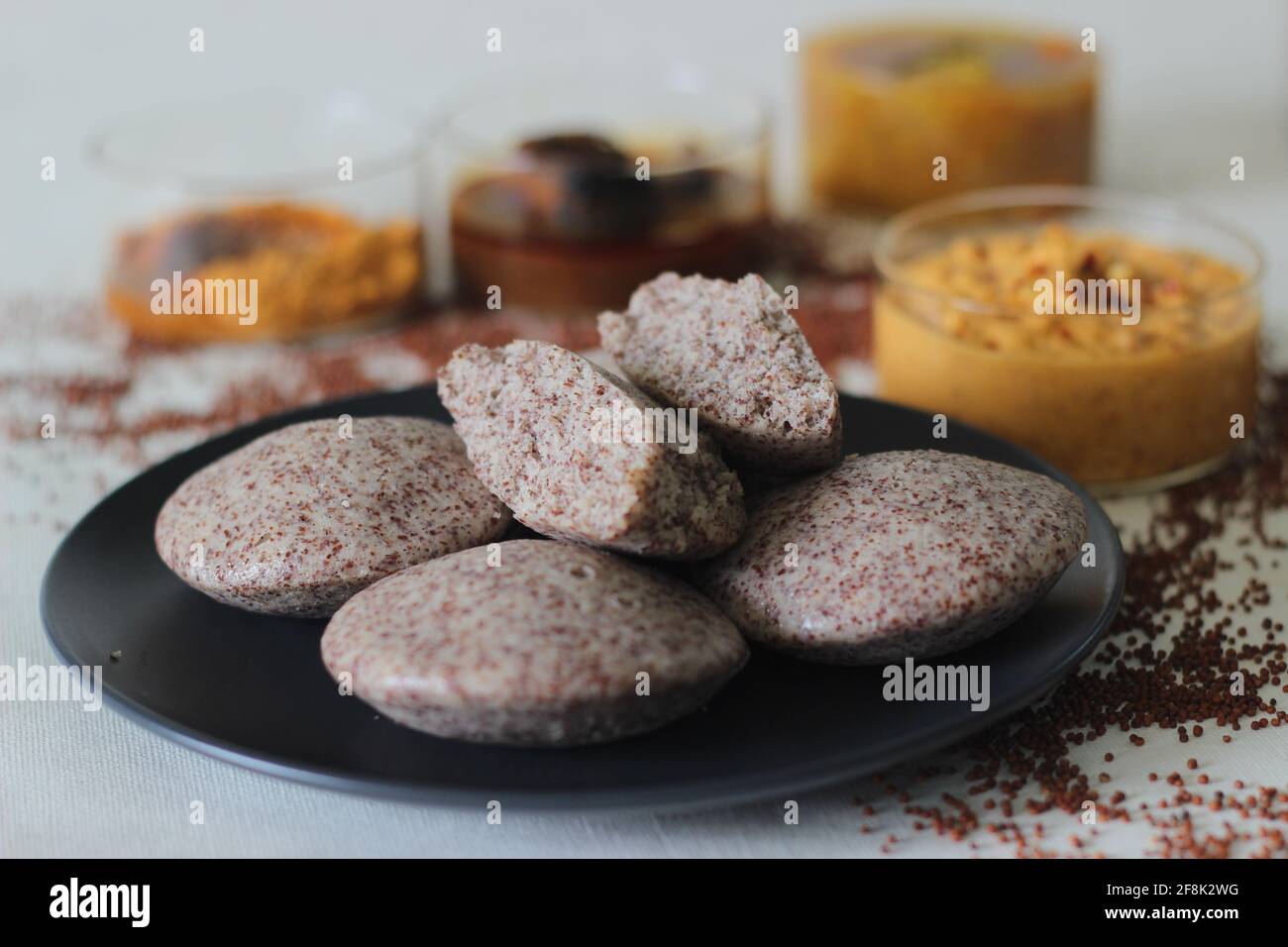 Steamed cakes made with finger millets and skinned black gram. Locally ...