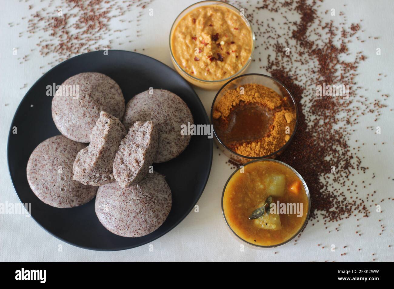 Steamed cakes made with finger millets and skinned black gram. Locally ...