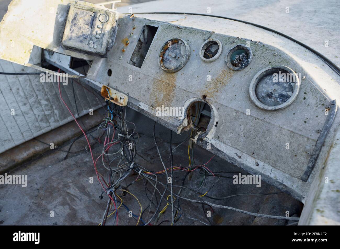 dashboard of old rusty sunken yacht in the water on the territory of ...