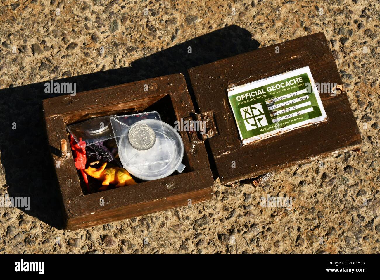 A soundly constructed geo caching container showing it official label ...