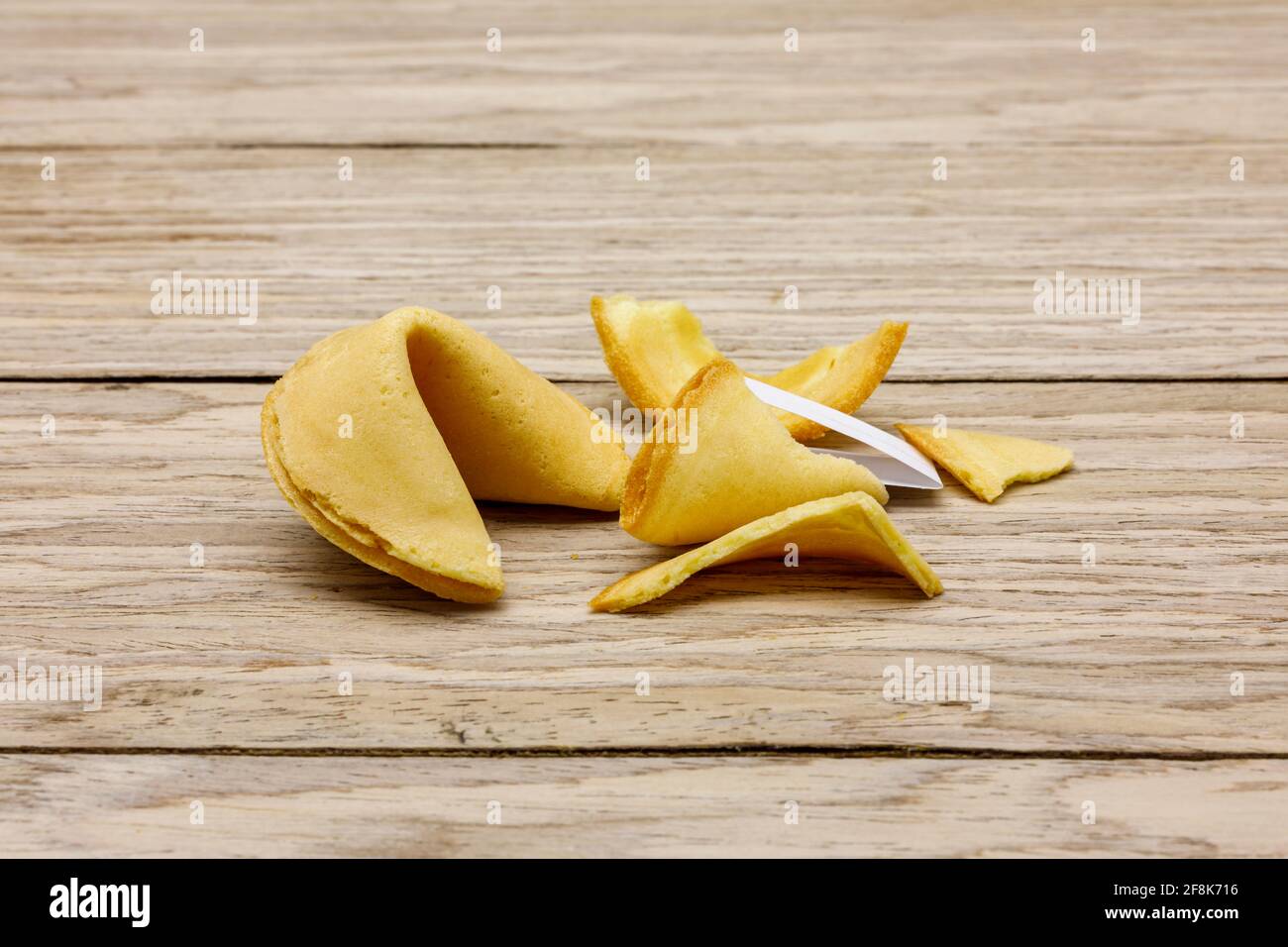 Two fortune cookies one broken open Stock Photo - Alamy