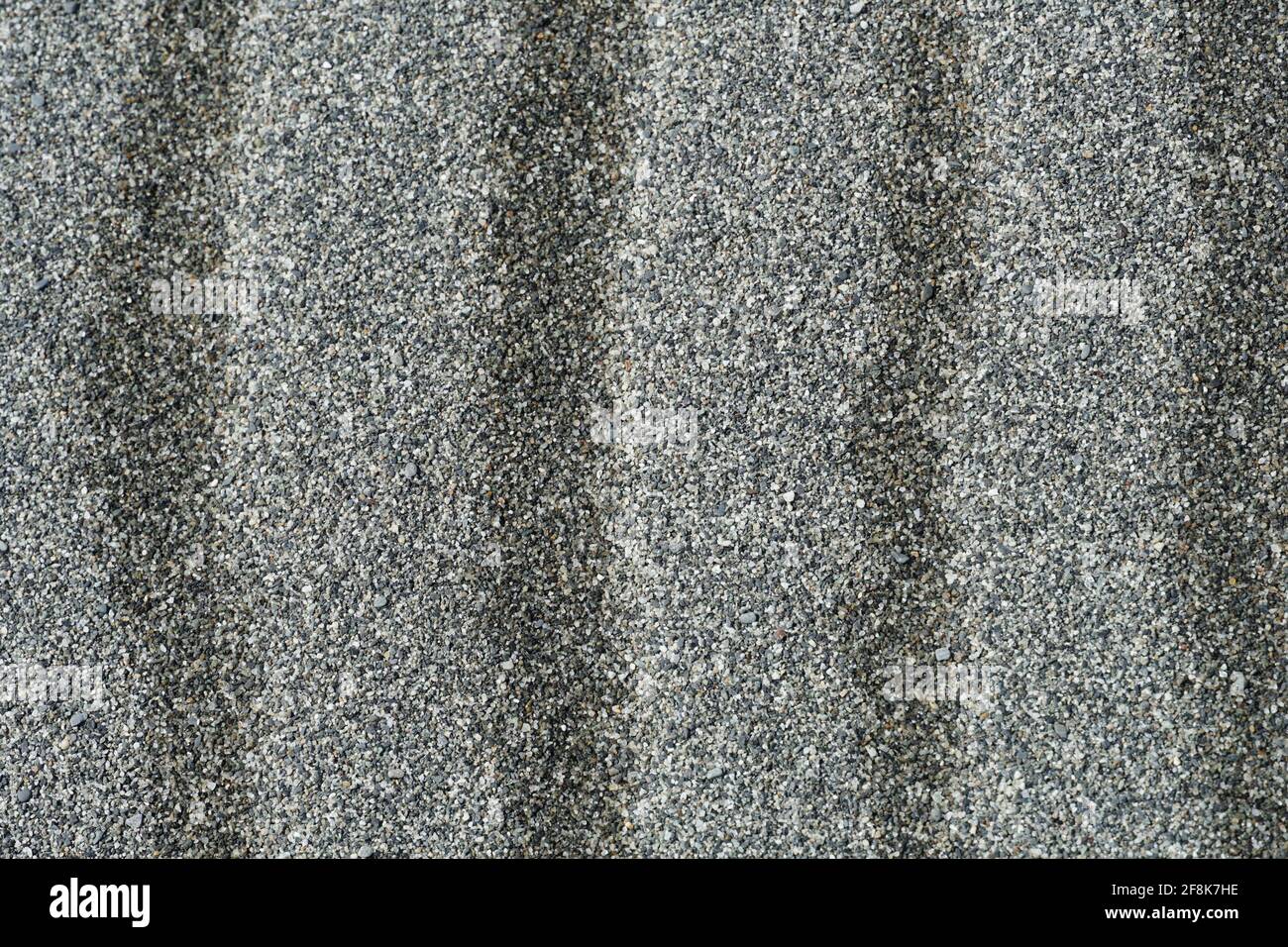 Grey sand texture at the beach after the wind Stock Photo - Alamy