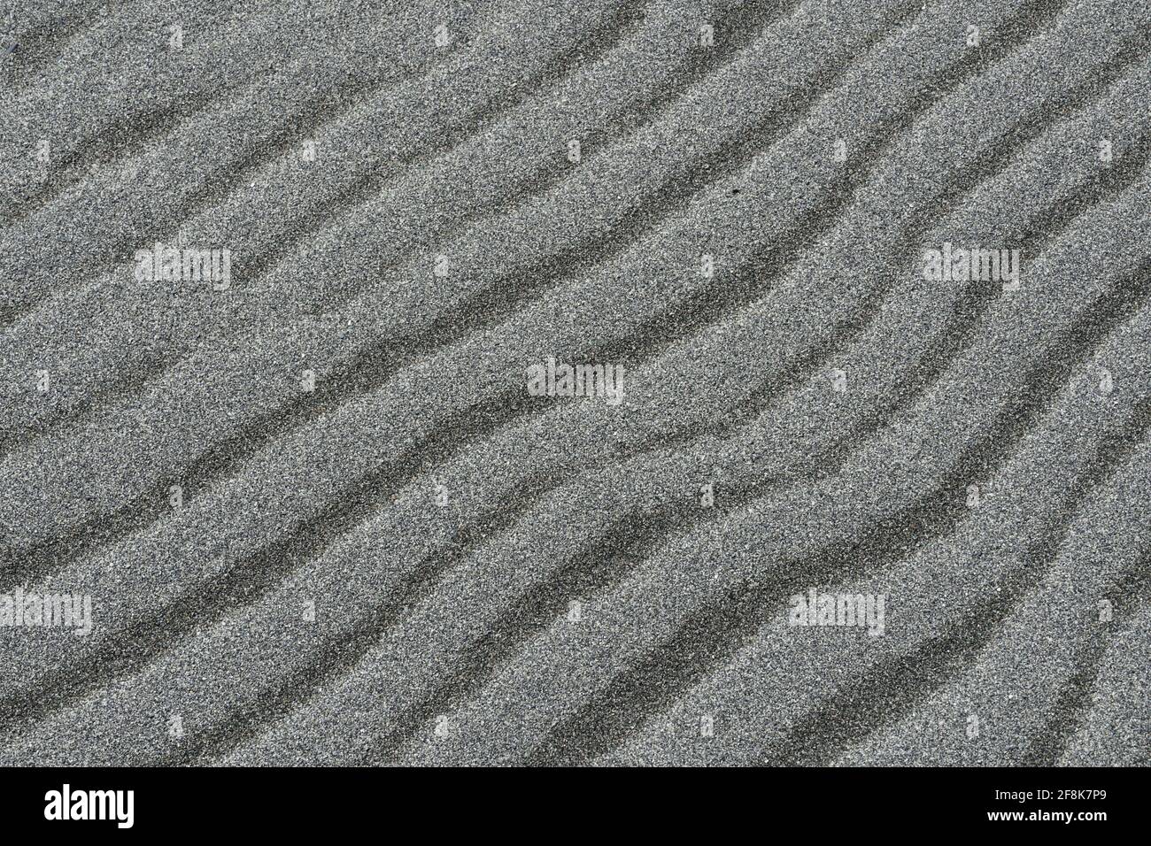 Grey sand texture at the beach after the wind Stock Photo - Alamy