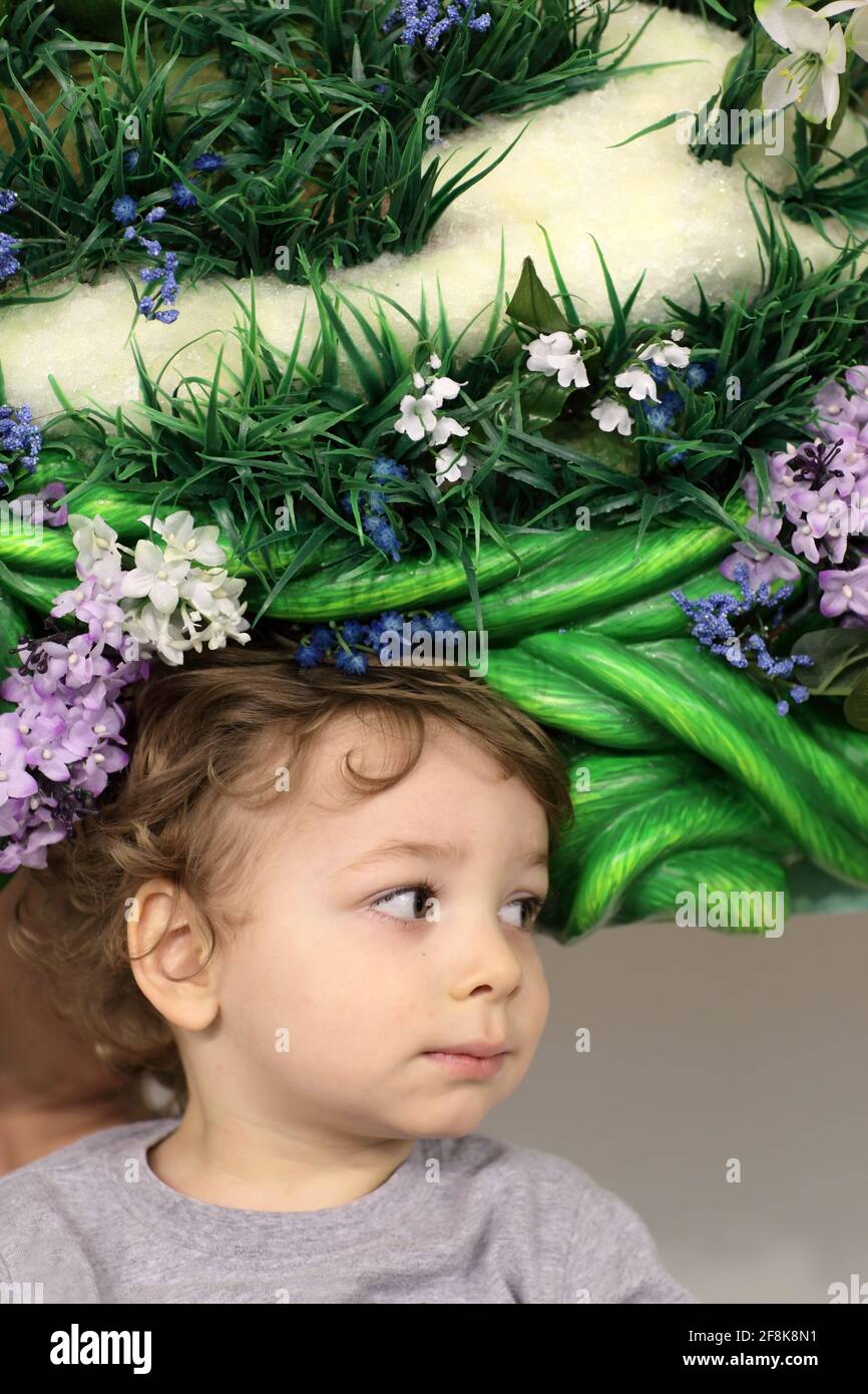 Portrait of child in a spring crown Stock Photo - Alamy