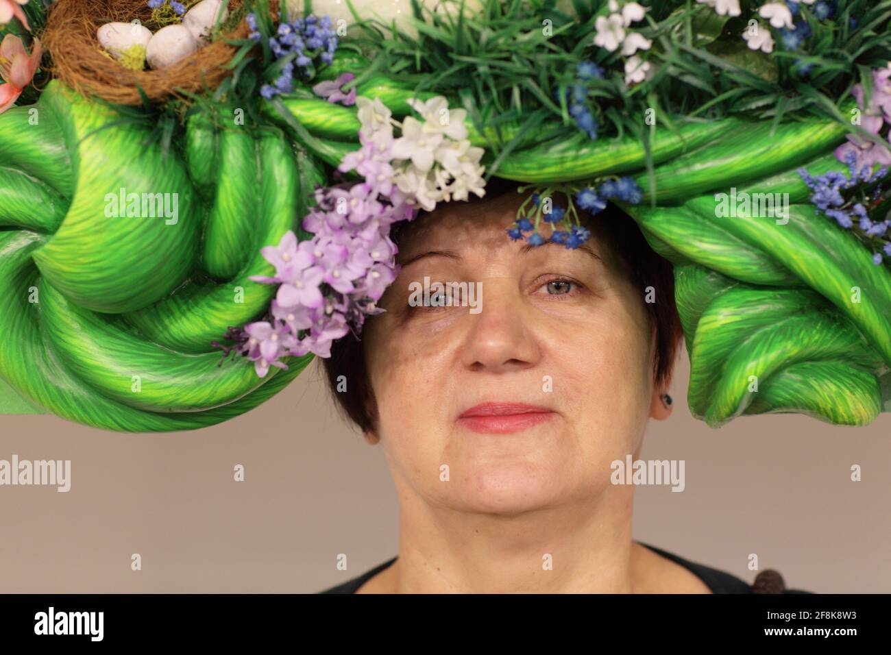 Portrait of mature woman in a spring crown Stock Photo - Alamy