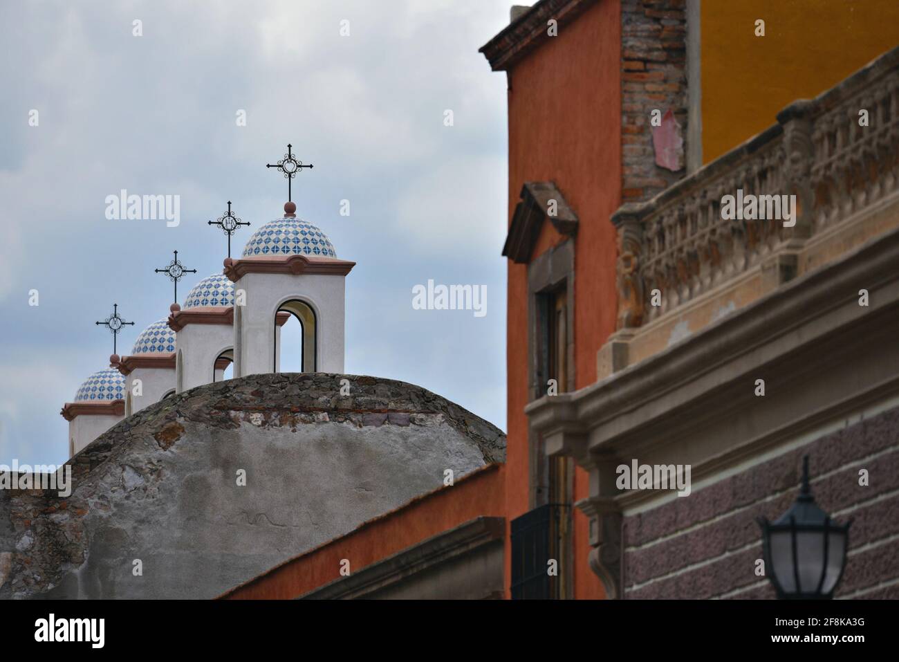 Bell towers with a Talavera tile cupola in the historic center of San ...