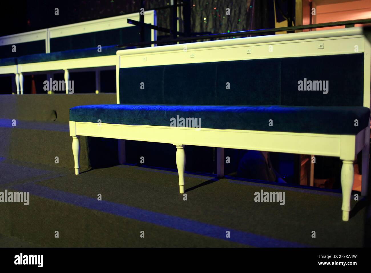 Details of the bench in a dark theater Stock Photo - Alamy