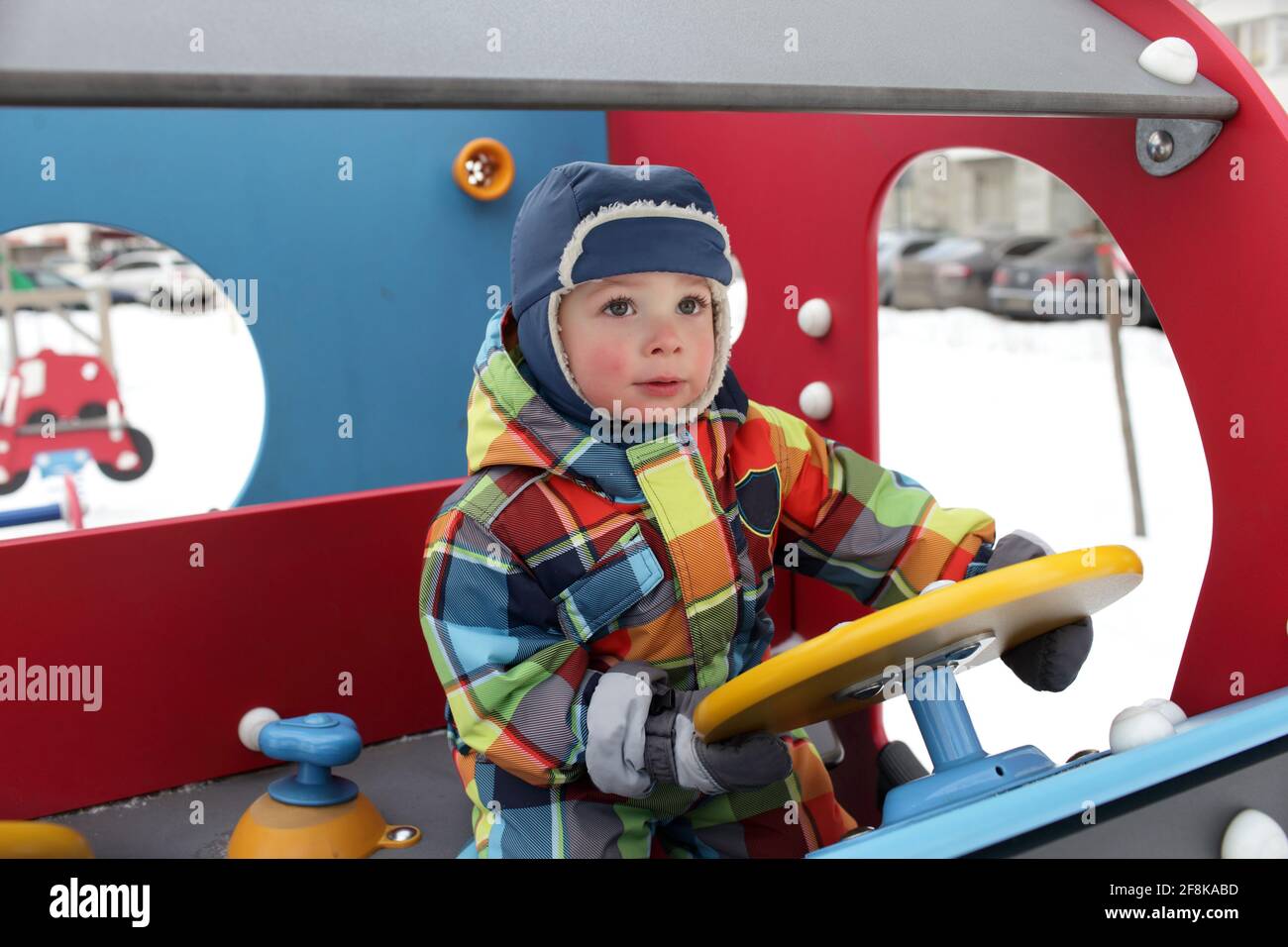 Child driving in the toy car in winter Stock Photo - Alamy