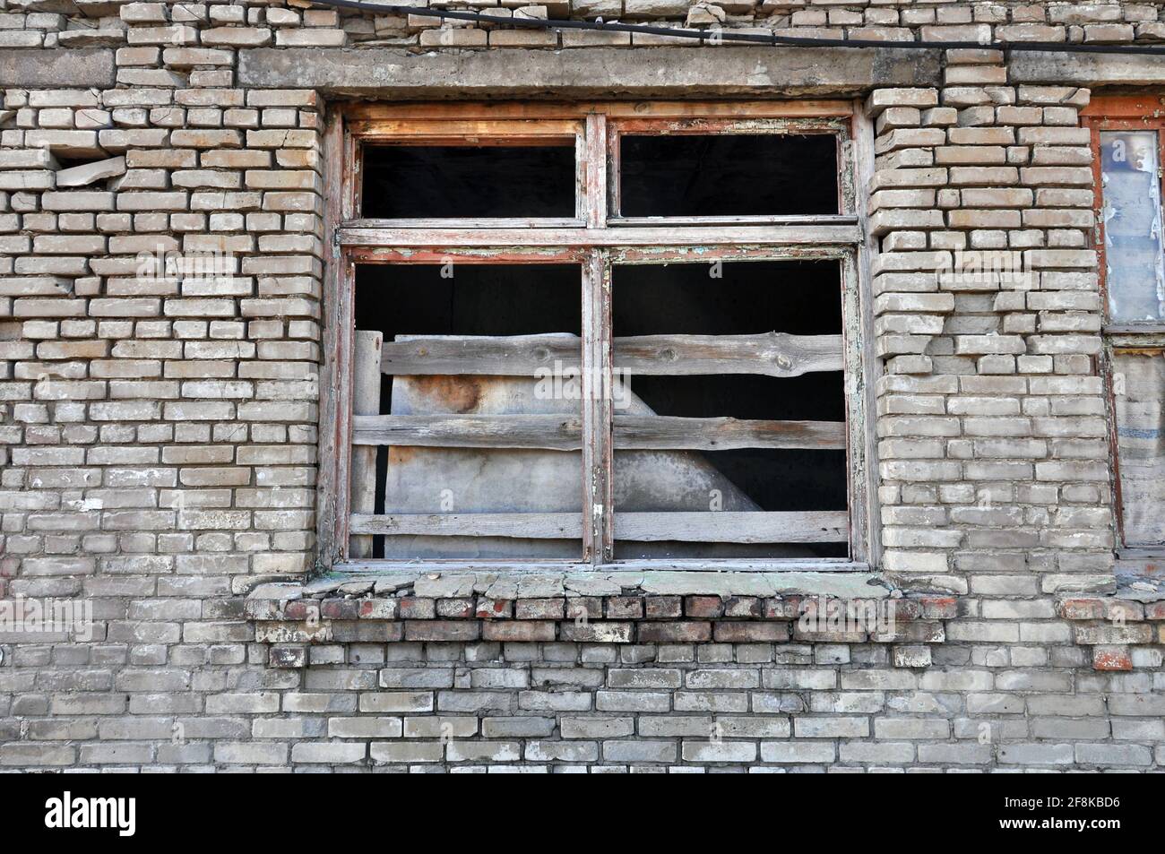 Front of abandoned building. Wall with window. Ruin, devastation ...