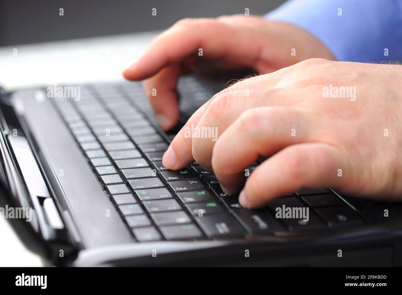 Male hands typing on a laptop keyboard. Programmer, Mobile Application ...