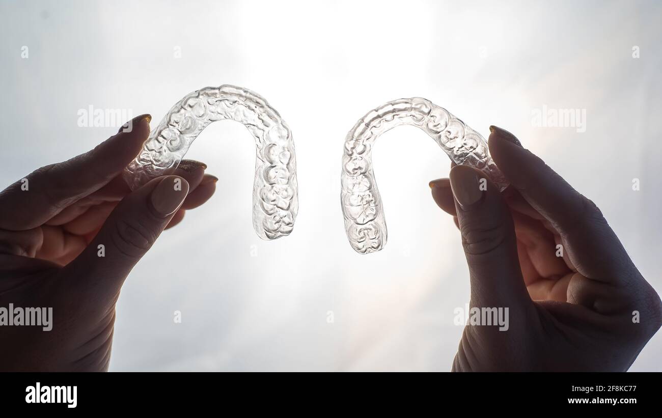 Transparent trays for correcting teeth in female hands. Removable ...