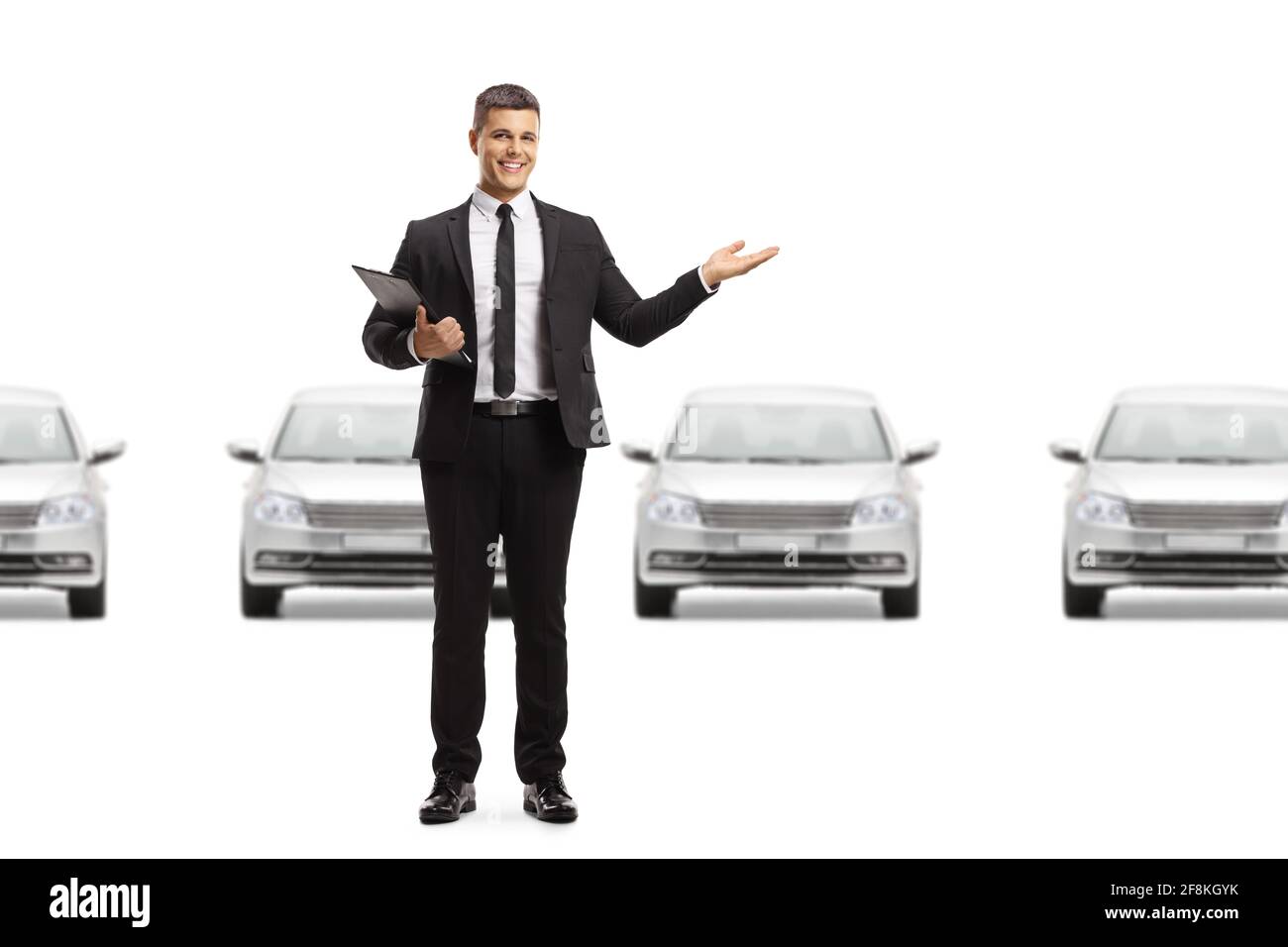 Man in a showroom presenting new cars isolated on white background ...