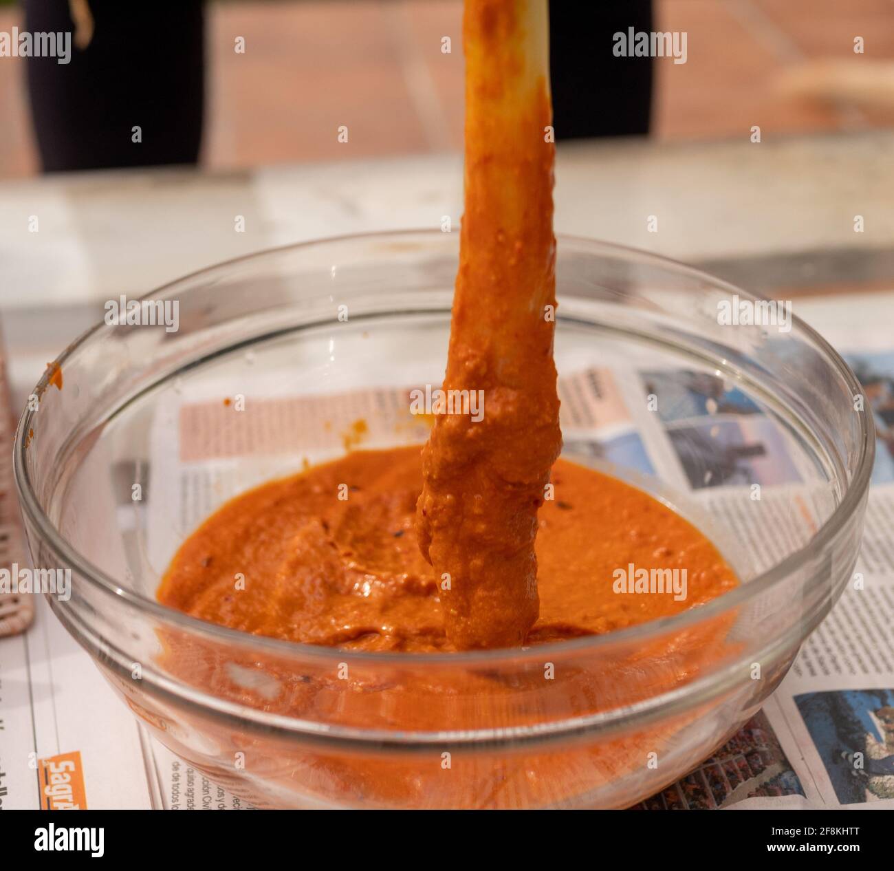 Shot of spring onion barbecue in sauce, typical Spanish product of ...