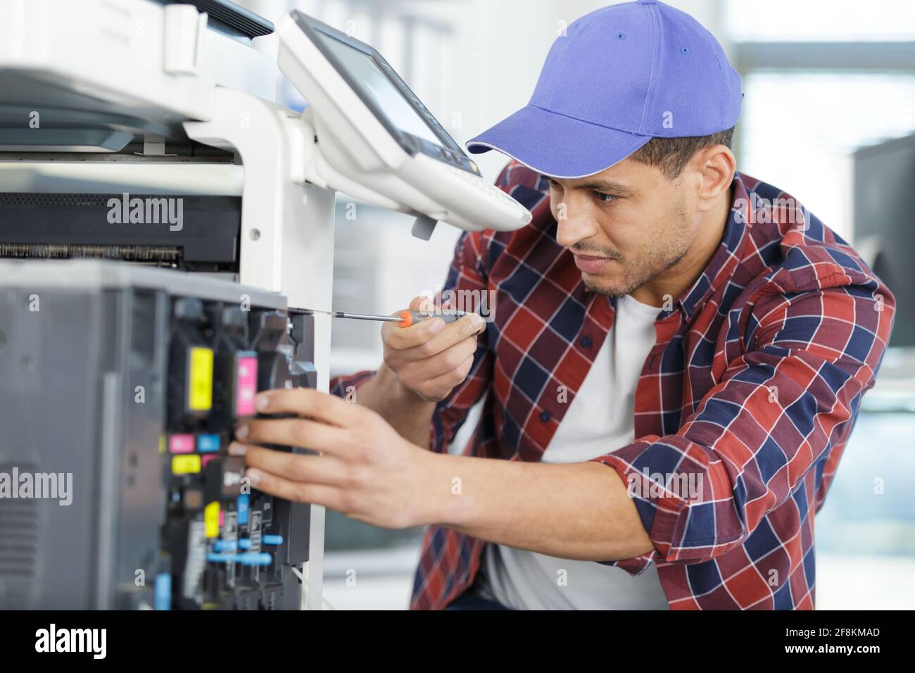 middle age man fixing a printer Stock Photo - Alamy