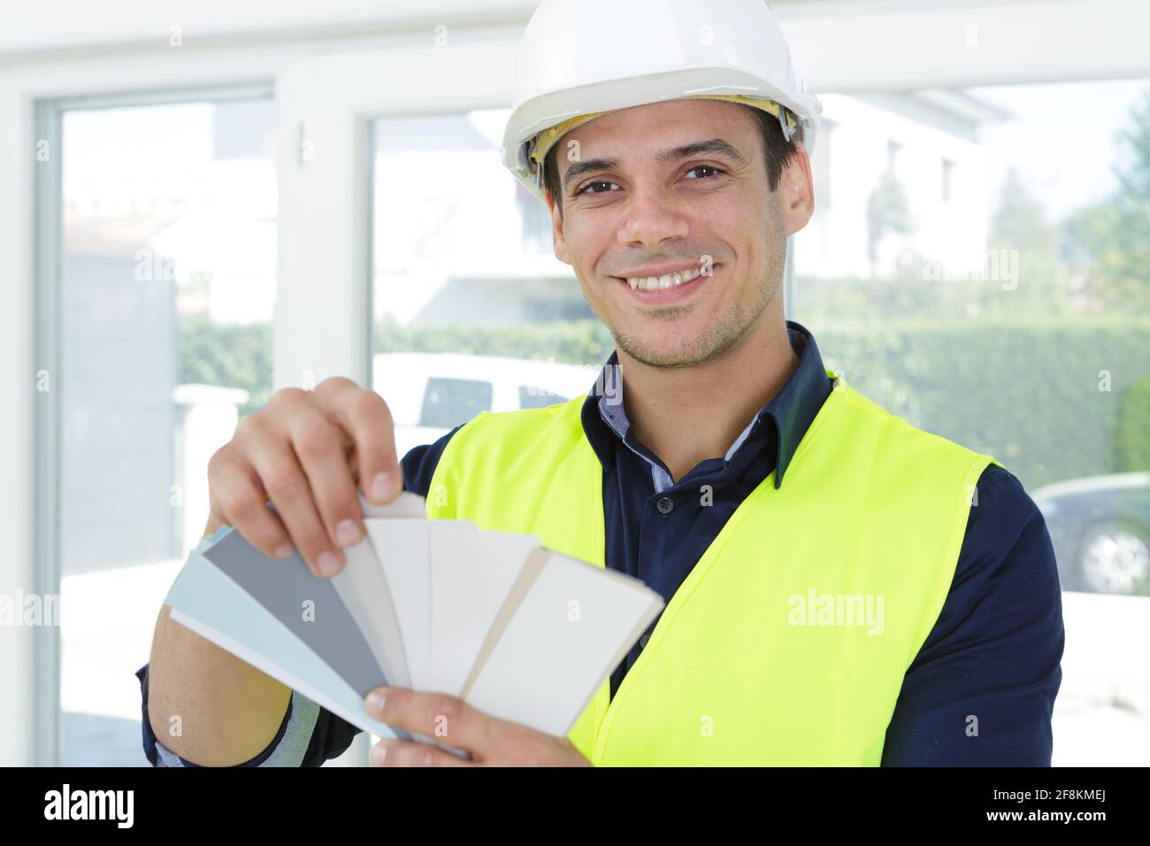 Smiling architect choosing material hi-res stock photography and images ...