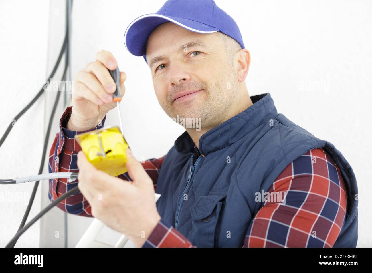 Electrician installing electric meter hi-res stock photography and ...