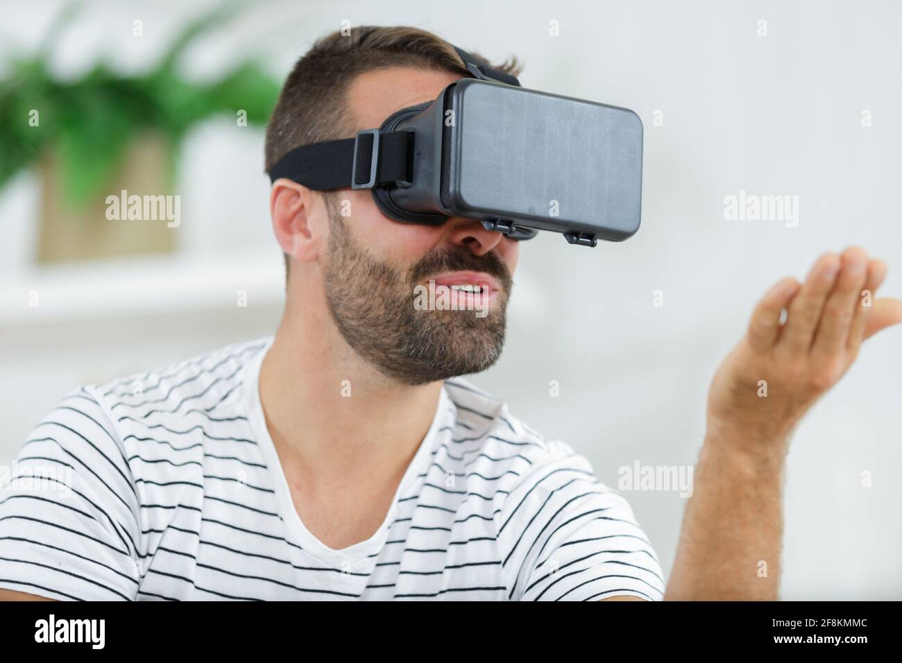 man using virtual reality googles Stock Photo - Alamy