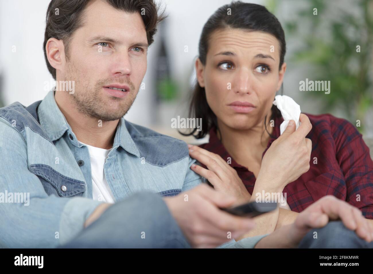young couple watching sad movie woman cry Stock Photo - Alamy