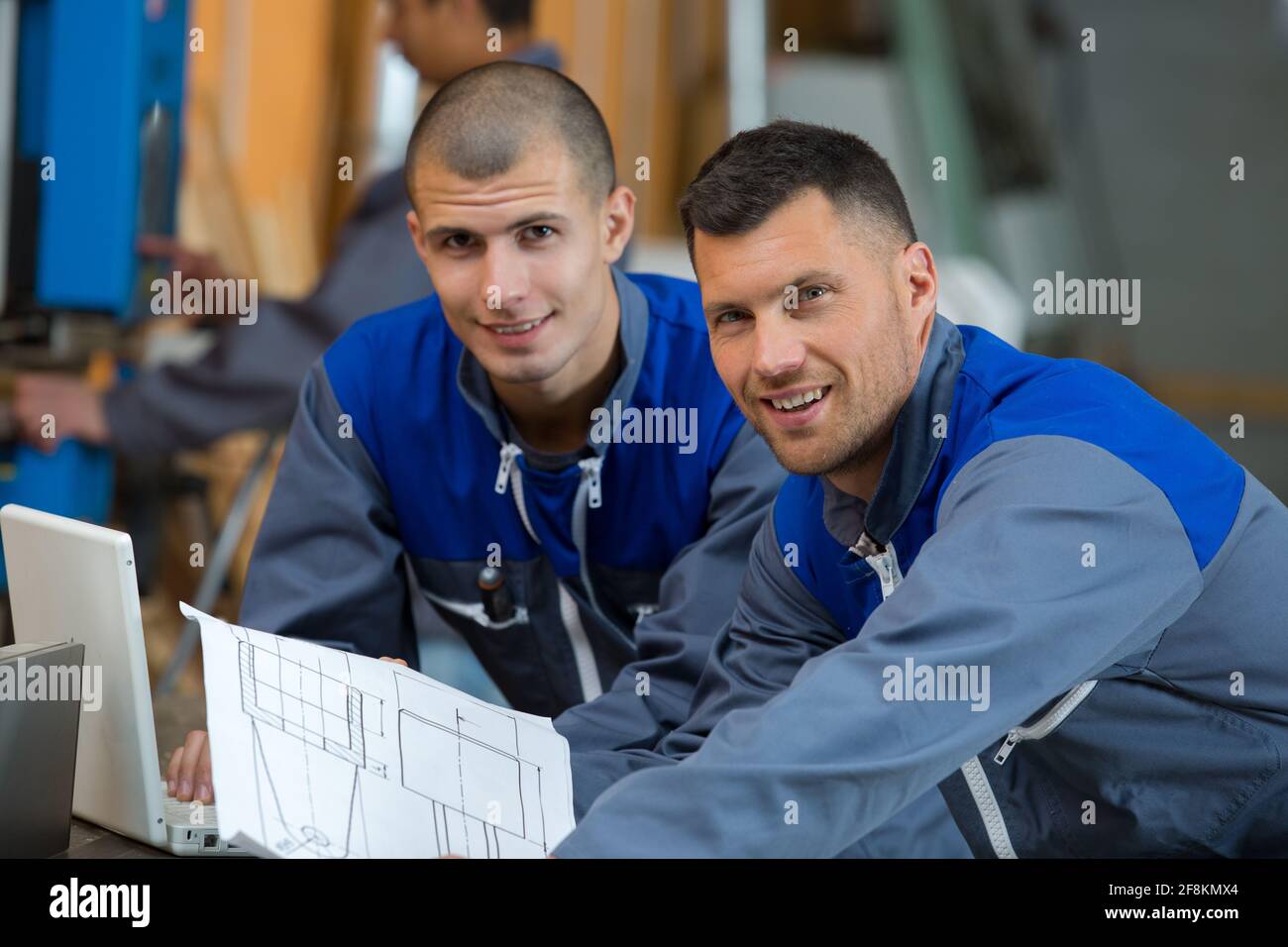 2 mechanic men try to fix and setup boat engine Stock Photo - Alamy
