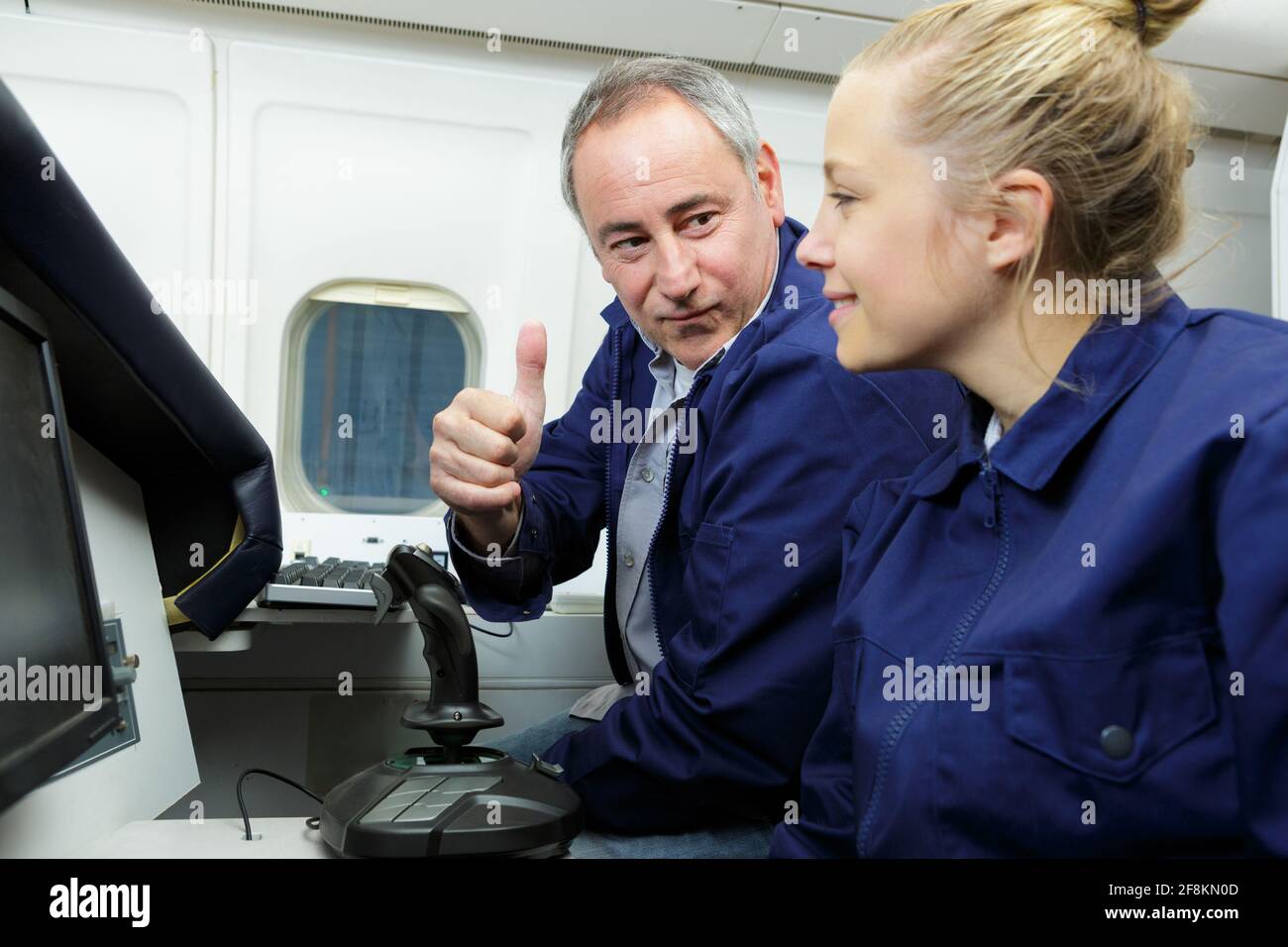 female aero engineer working on helicopter with teacher Stock Photo - Alamy