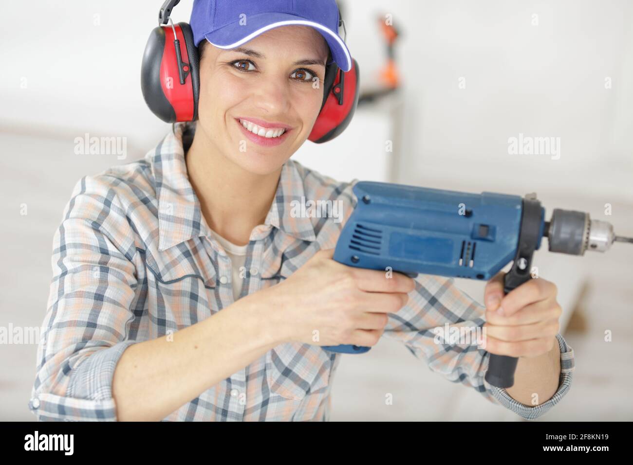 woman worker with pneumatich hammer drill perforator Stock Photo - Alamy