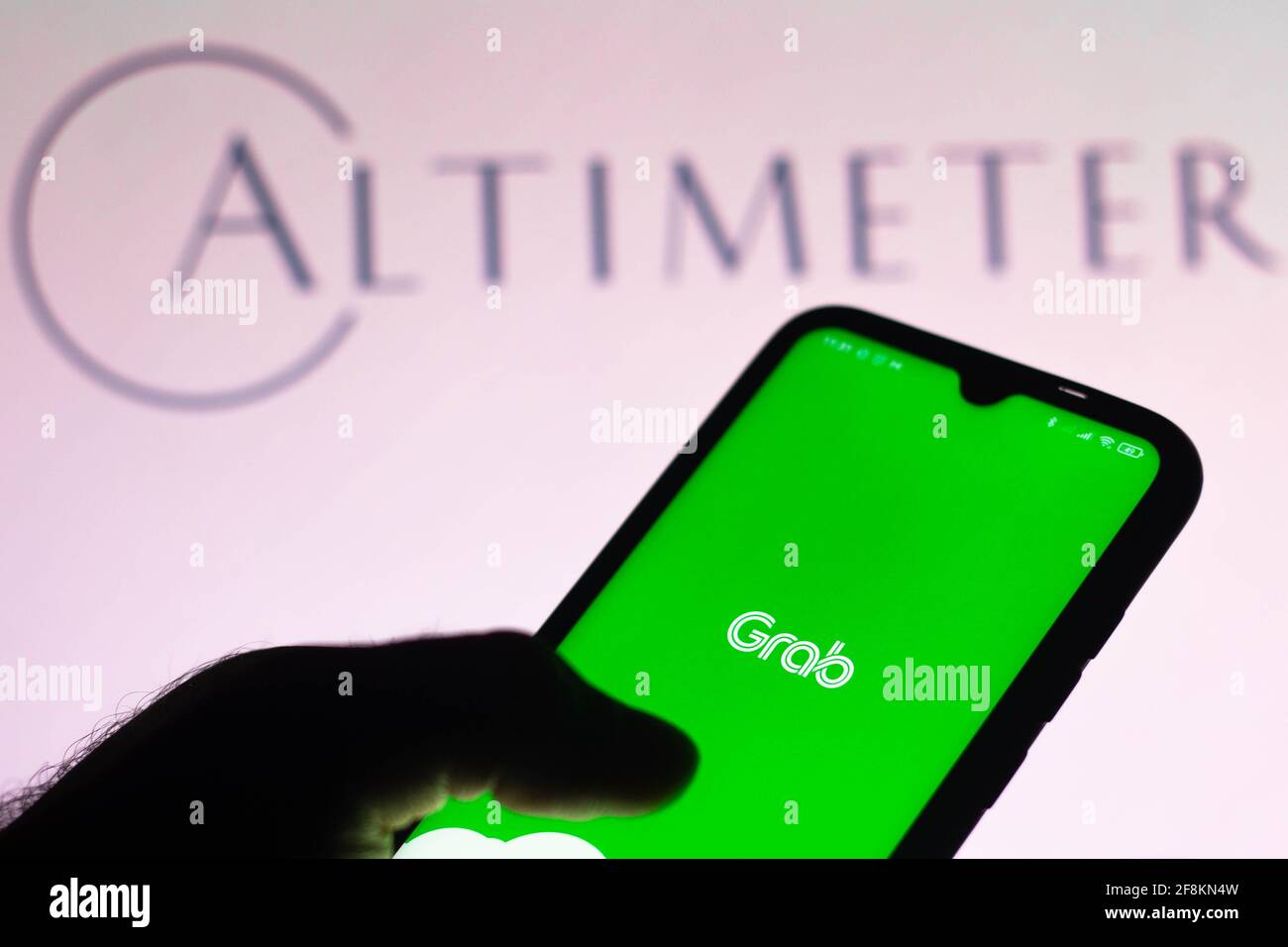 In this photo illustration, the Grab Holdings logo seen displayed on a ...