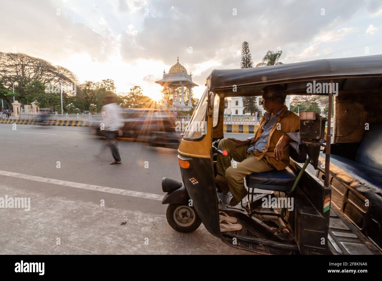 Mysuru, Karnataka, India - January 2019: A rickshaw driver at a busy ...