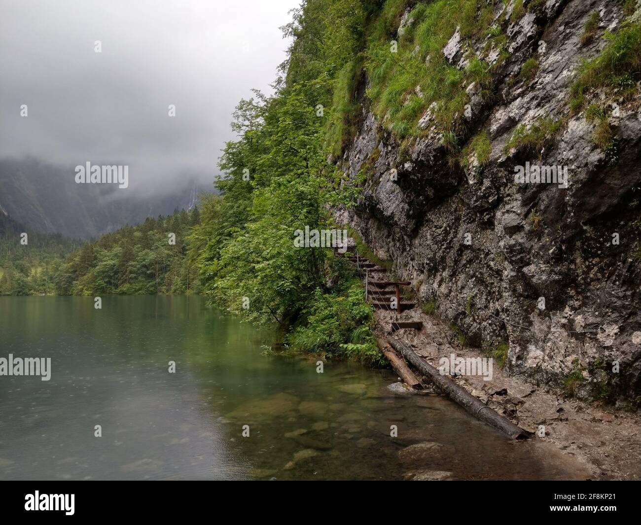 View on rocky path running along a cliffside at Obersee in ...