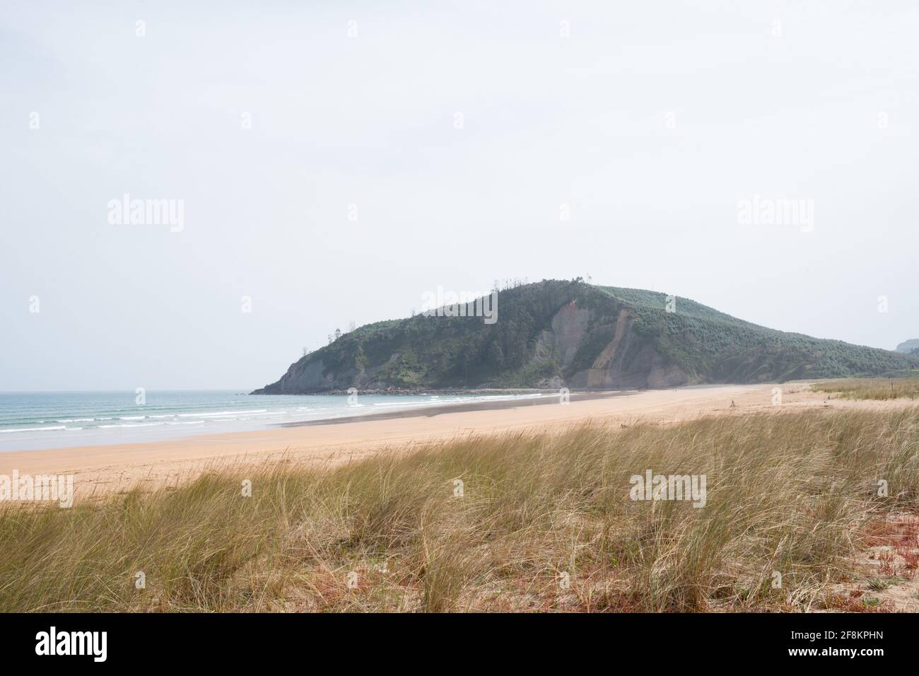 Beautiful landscape with Rodiles beach and the hill next to it ...