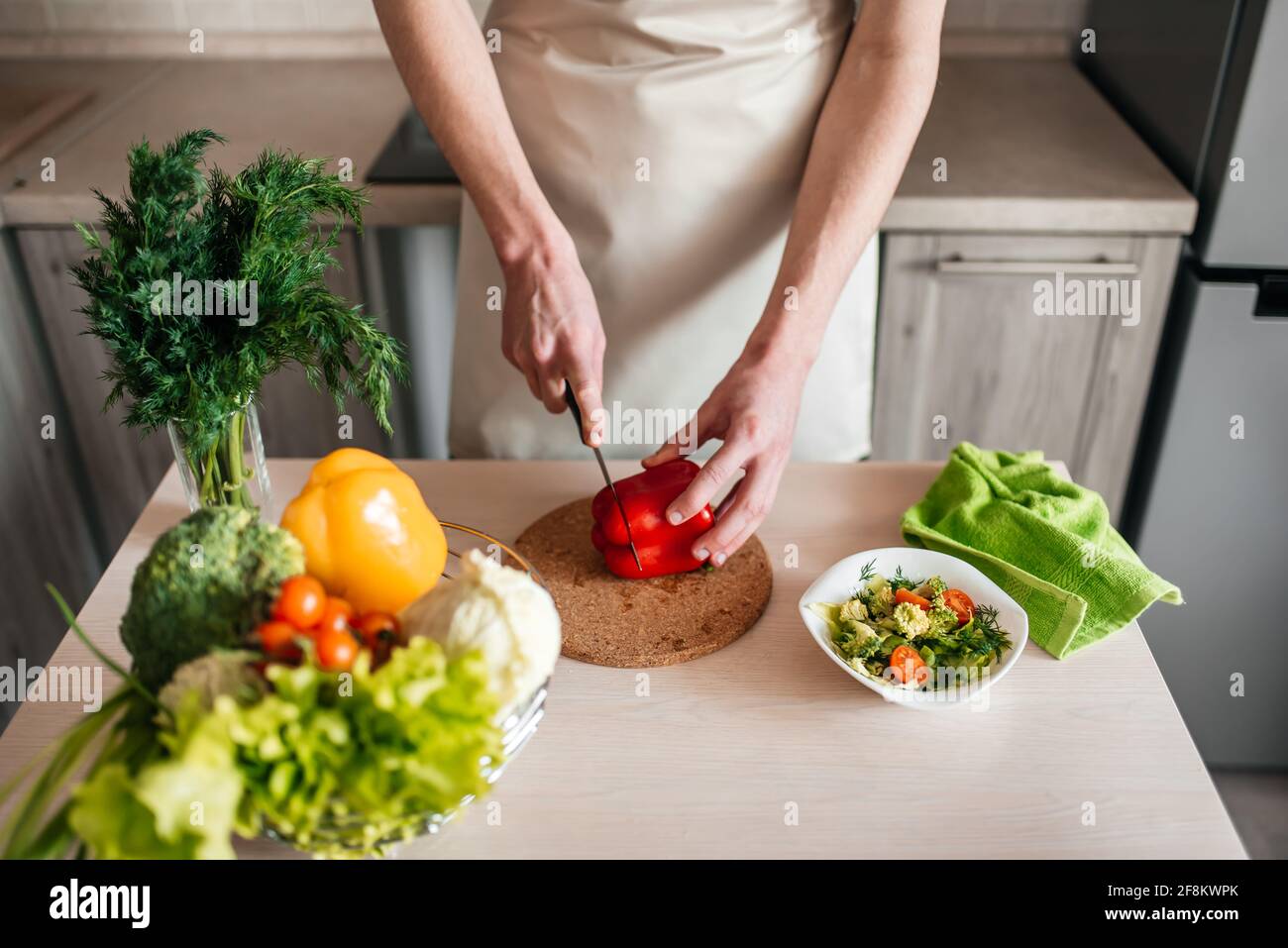 male hands chopping salad and onion, cooking healthy food in the ...