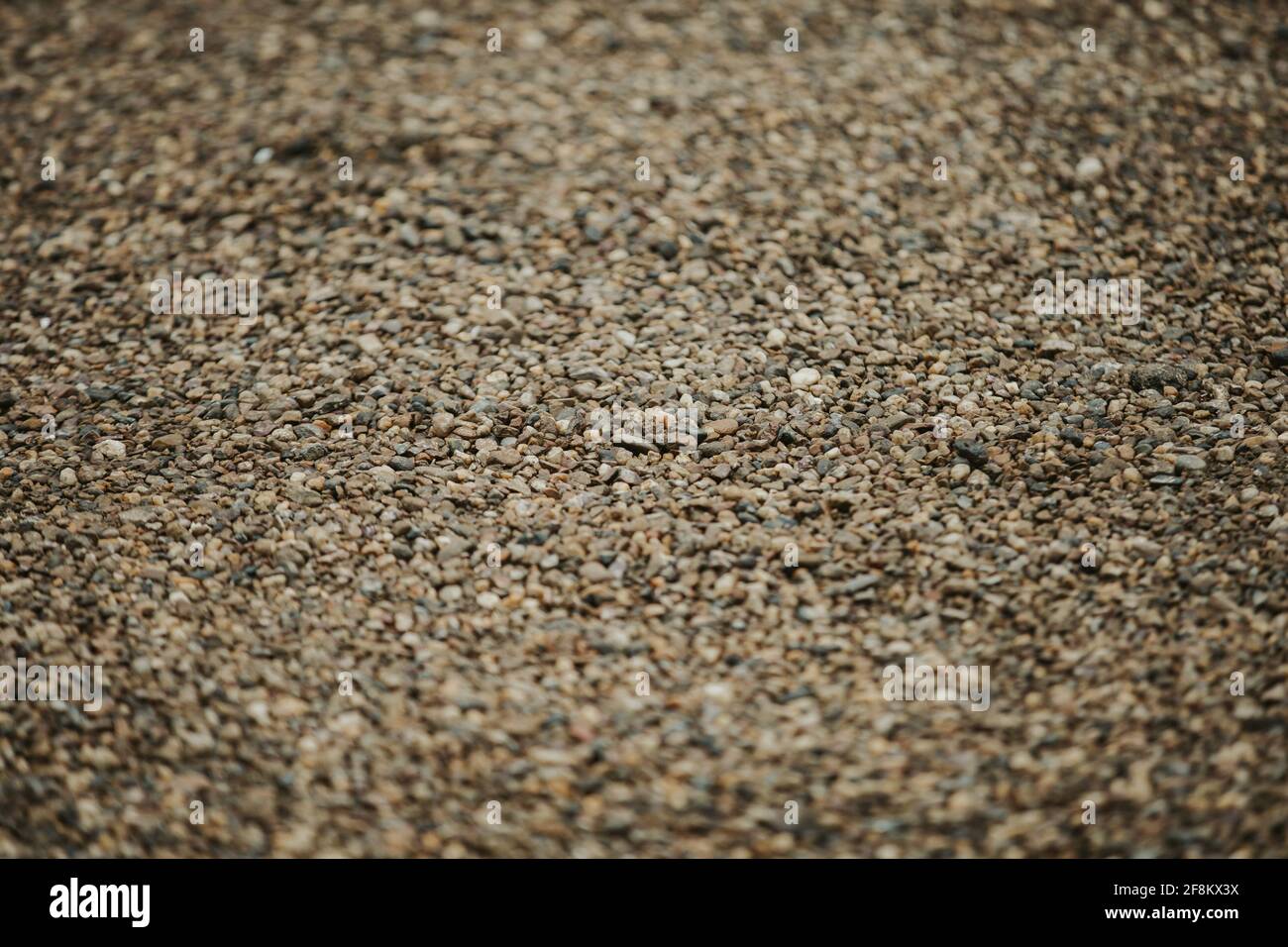 Ground texture with small brown pebbles Stock Photo - Alamy