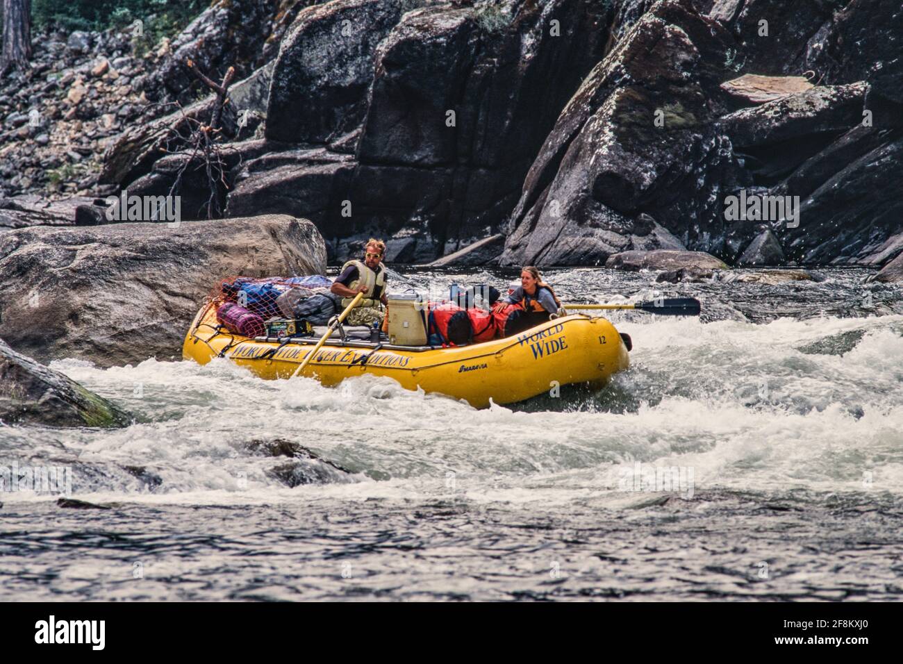 An inflatable raft shoots the rapids on the Salmon River in the Frank ...