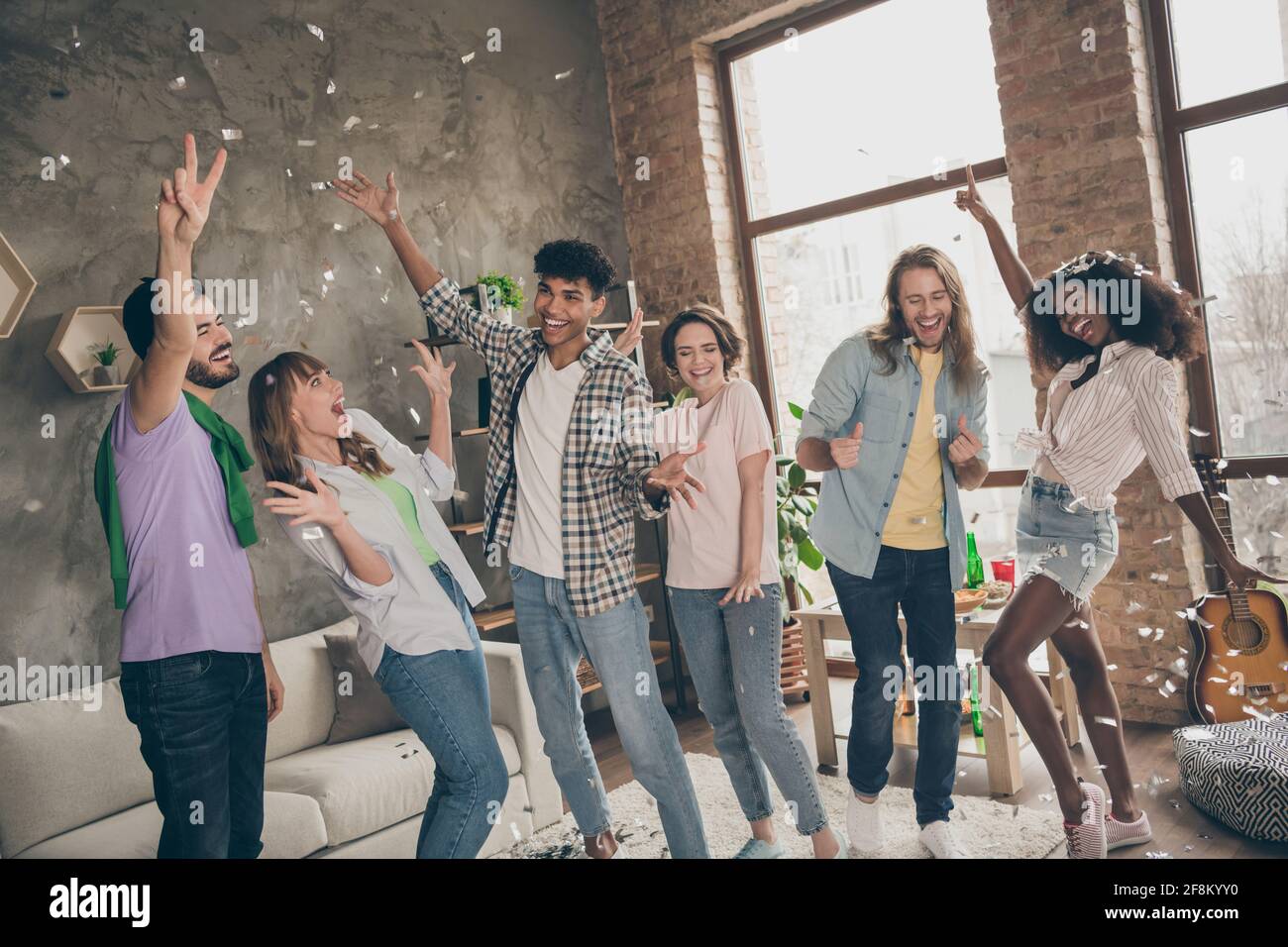 Photo portrait of cheerful company celebrating exams ending at party ...