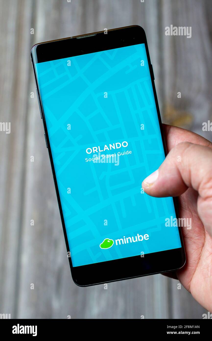 A Mobile phone or Cell phone being held in a hand showing the Orlando ...