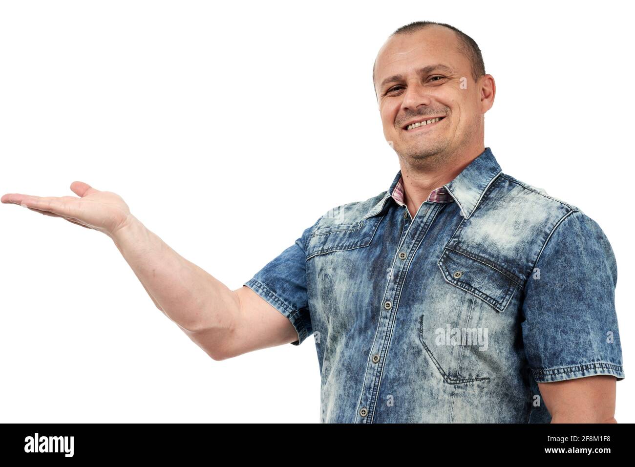 Caucasian man displaying an invisible product, isolated on white ...