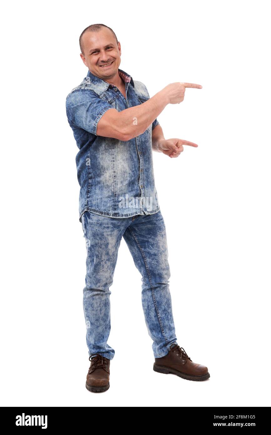 Caucasian man pointing to the side of the image, full length isolated ...