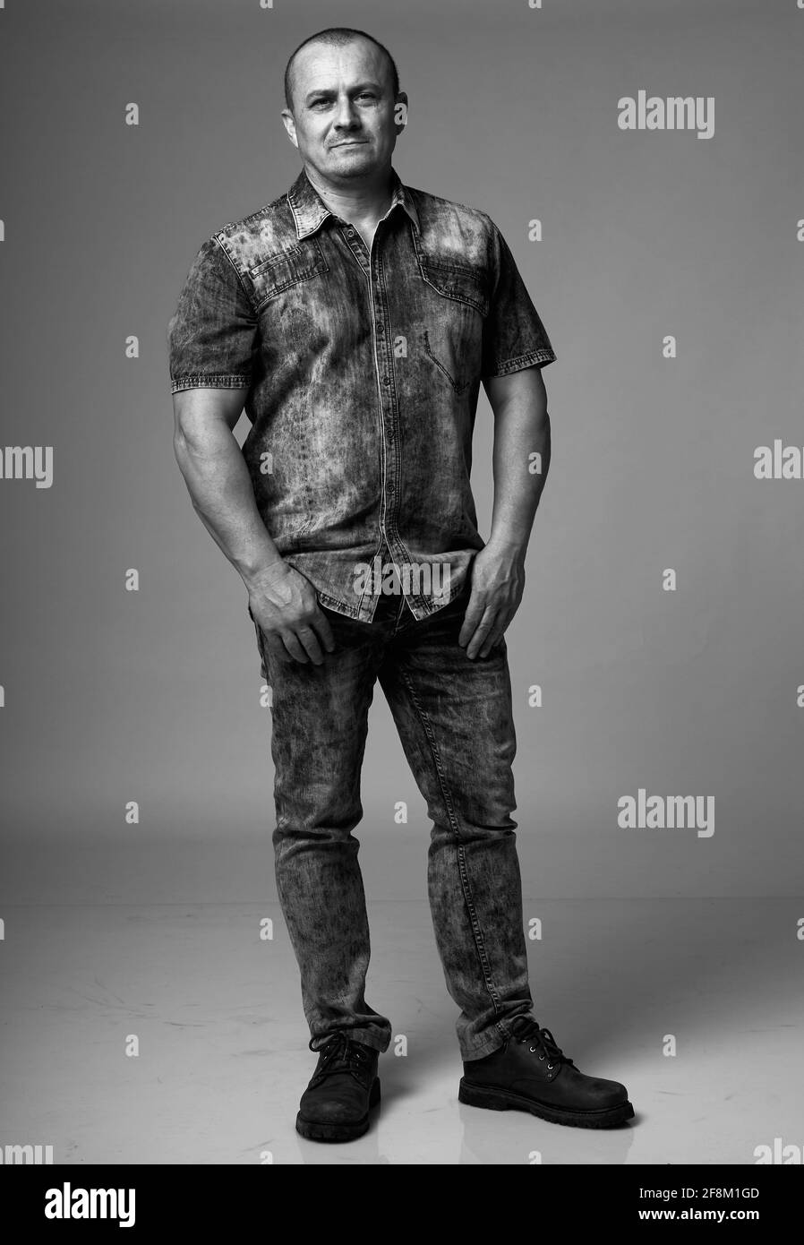 Smart casual dressed man in monochrome toned full length portrait Stock ...