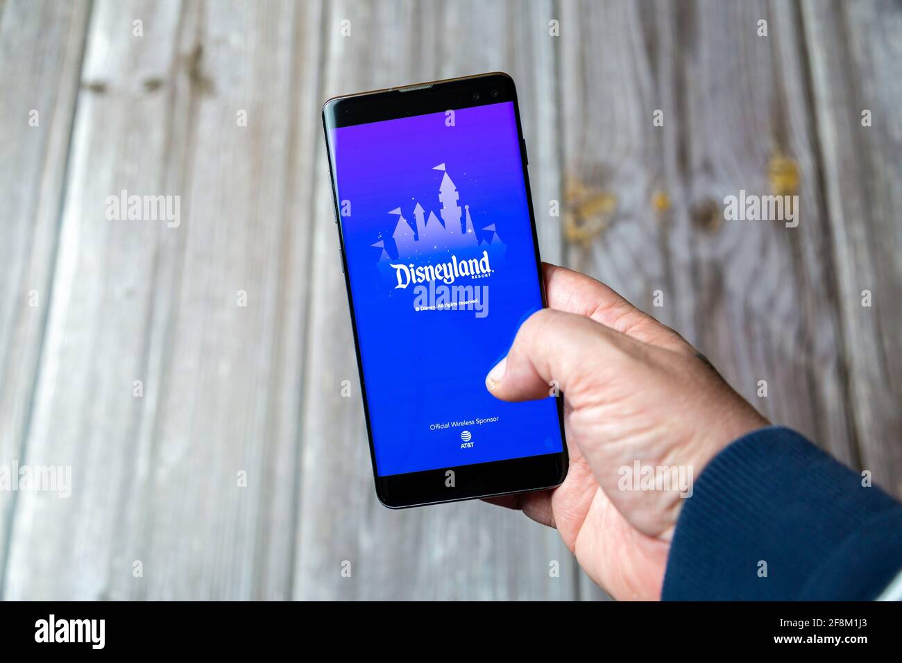 A Mobile phone or Cell phone being held in a hand showing the ...