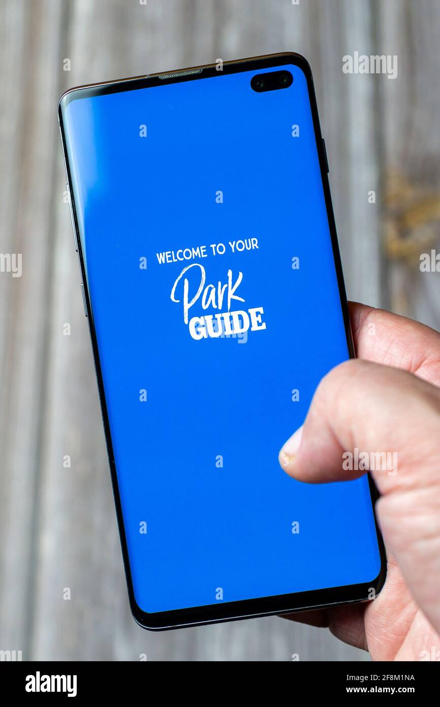 A Mobile phone or Cell phone being held in a hand showing the Park ...